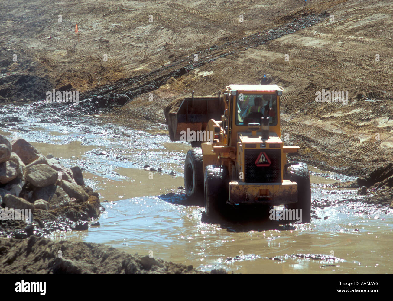 Wheel loader at construction site Stock Photo - Alamy