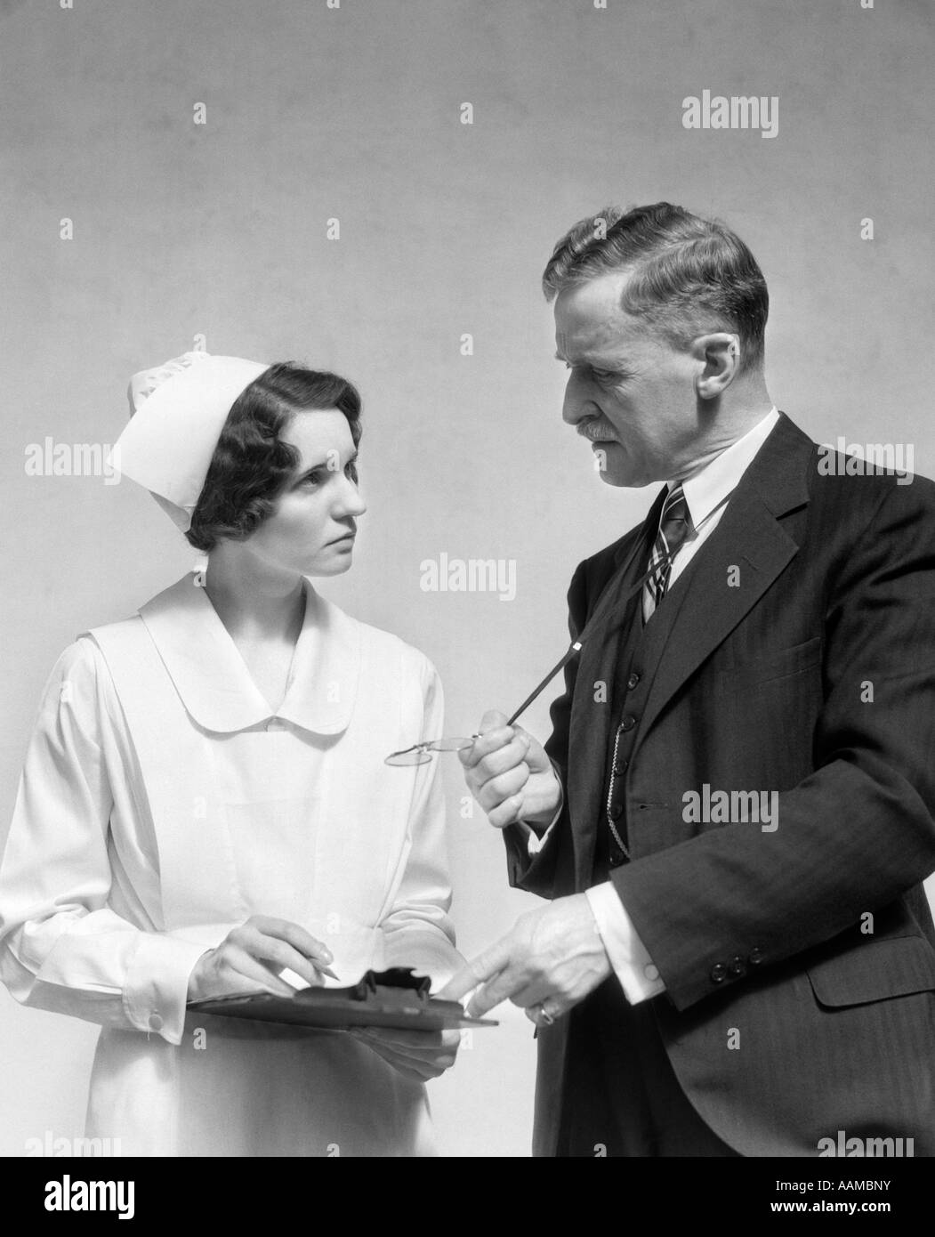 Two medical doctor in uniform Black and White Stock Photos & Images - Alamy