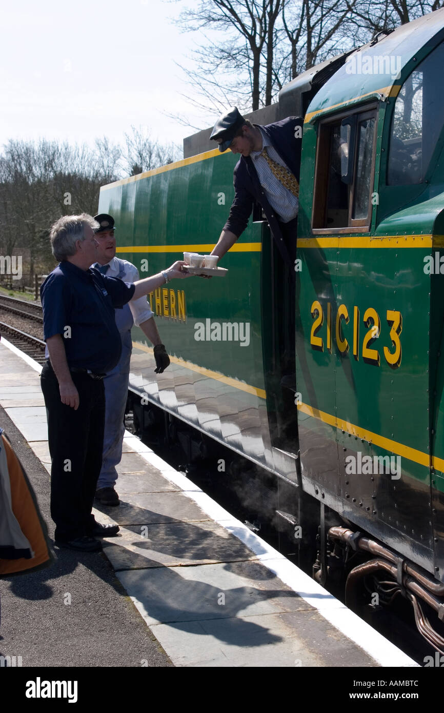 A cup of tea for the driver of a steam train on preserved Bluebell ...