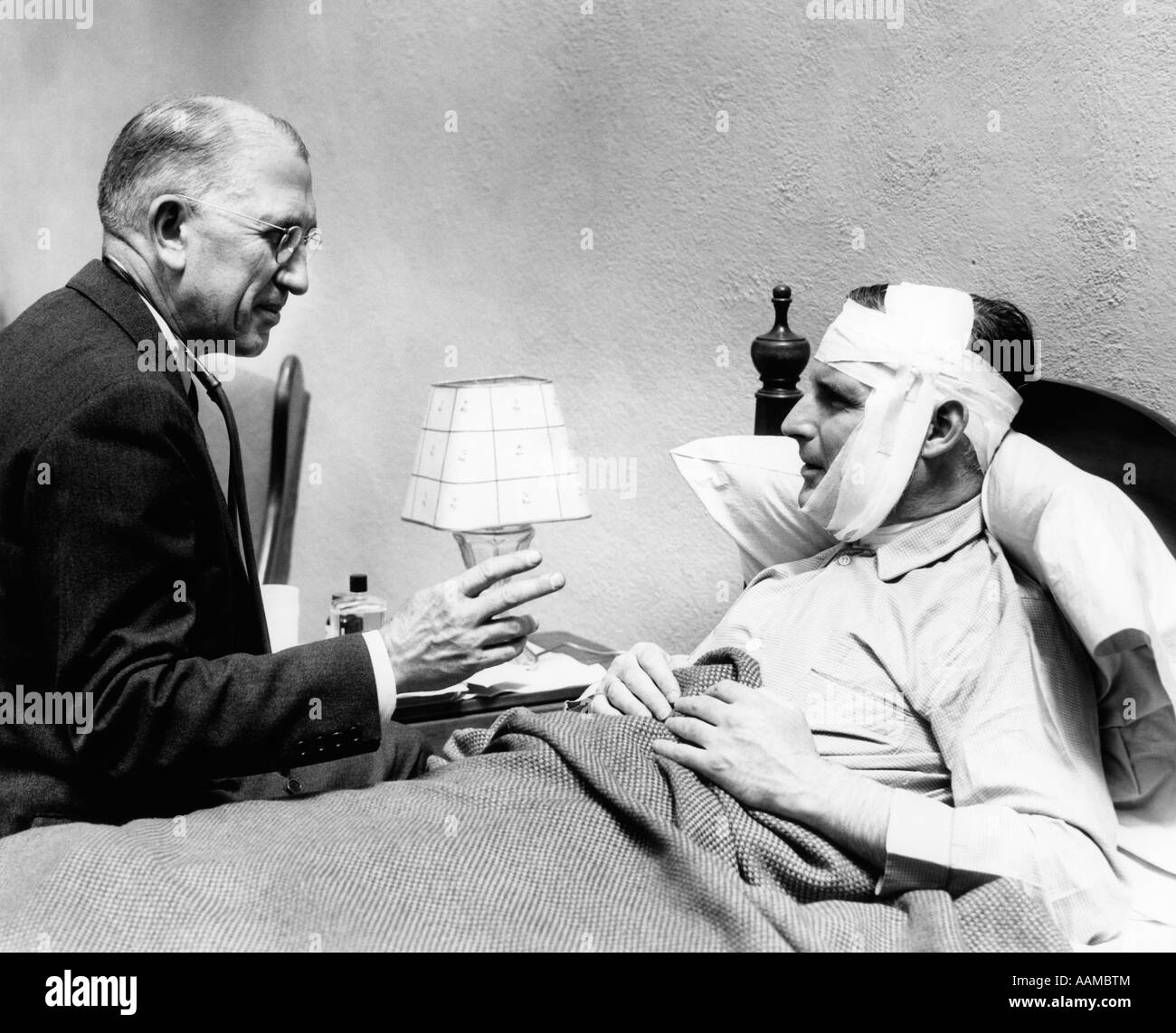 1940s DOCTOR MAKING HOUSE CALL TO MAN SICK IN BED HEAD IN BANDAGES ...