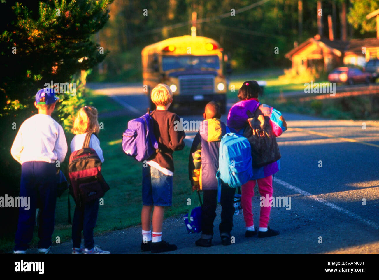 Children at bus stop NW Washington Stock Photo - Alamy