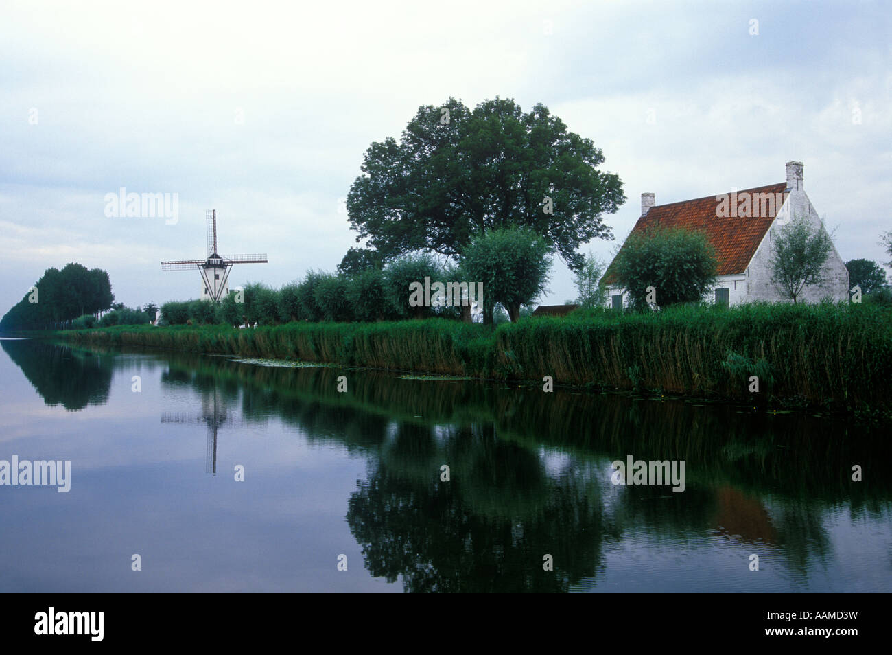 DAMME BELGIUM WINDMILL BY CANAL Stock Photo - Alamy