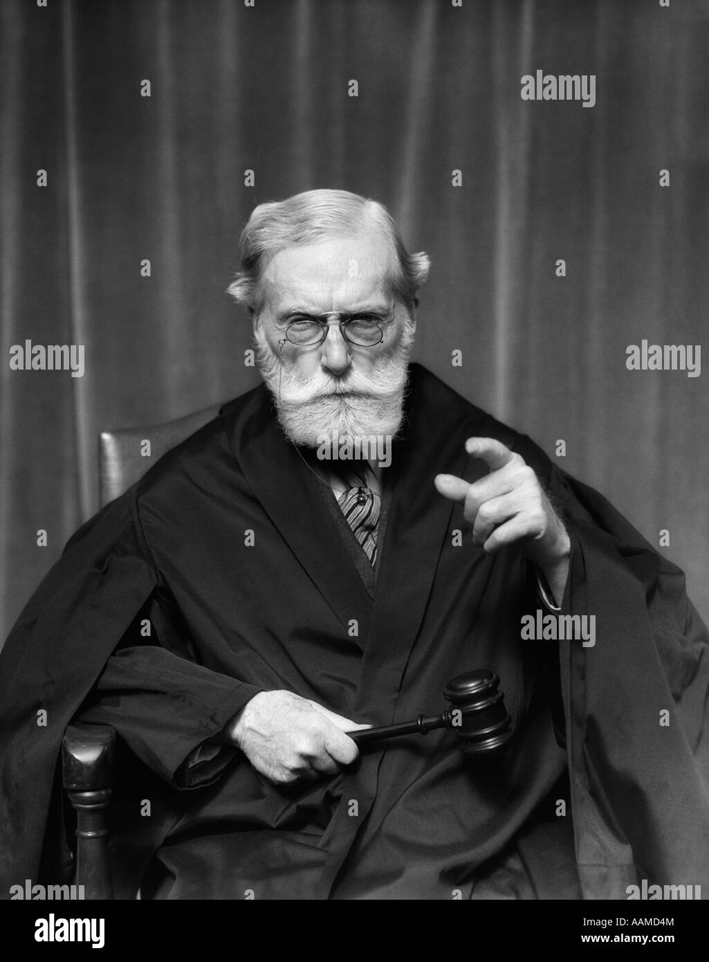 1930s STERN ELDERLY JUDGE WITH BEARD AND GLASSES POINTING AT CAMERA ...