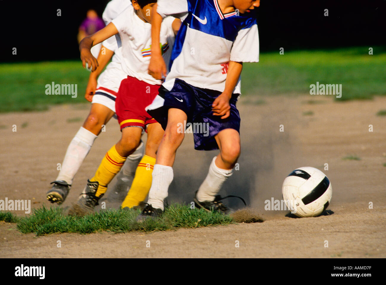 detail of kids soccer player s legs football Stock Photo - Alamy