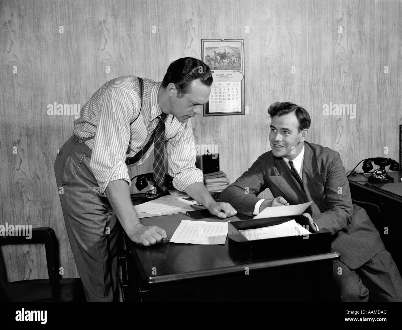 1940s TWO MEN AT DESK IN WOOD PANELED OFFICE ROOM Stock Photo - Alamy