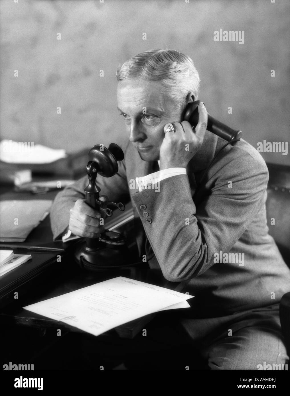 1920s BUSINESSMAN AT DESK TALKING ON CANDLESTICK PHONE Stock Photo - Alamy
