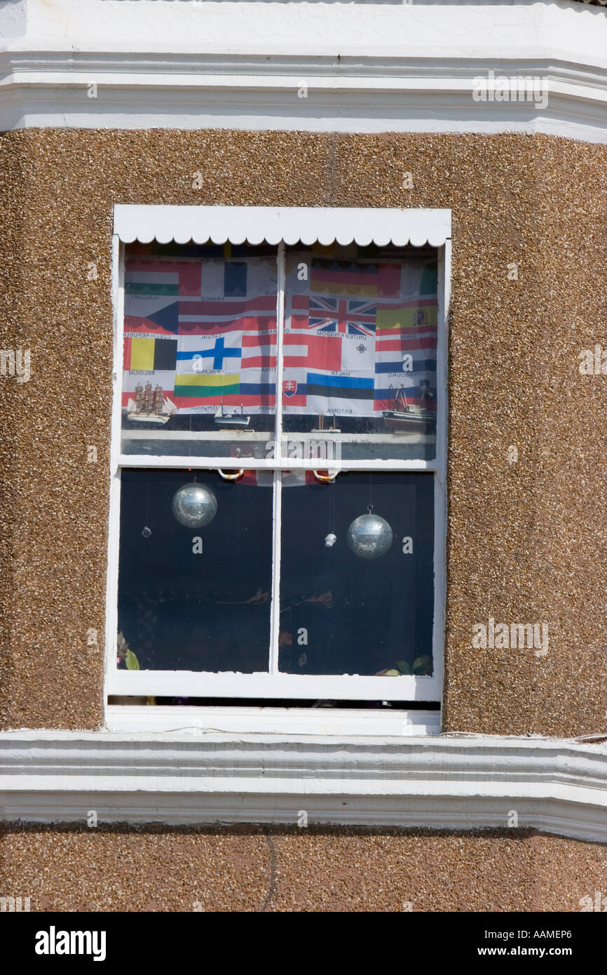 Window with flags of the world and glitter balls Stock Photo - Alamy