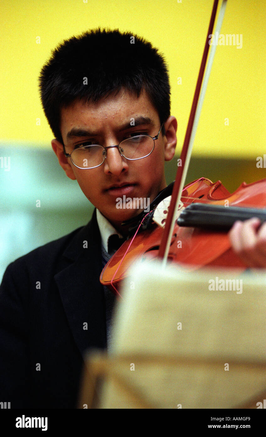 Secondary school pupil giving a solo violin performance, Southwark ...