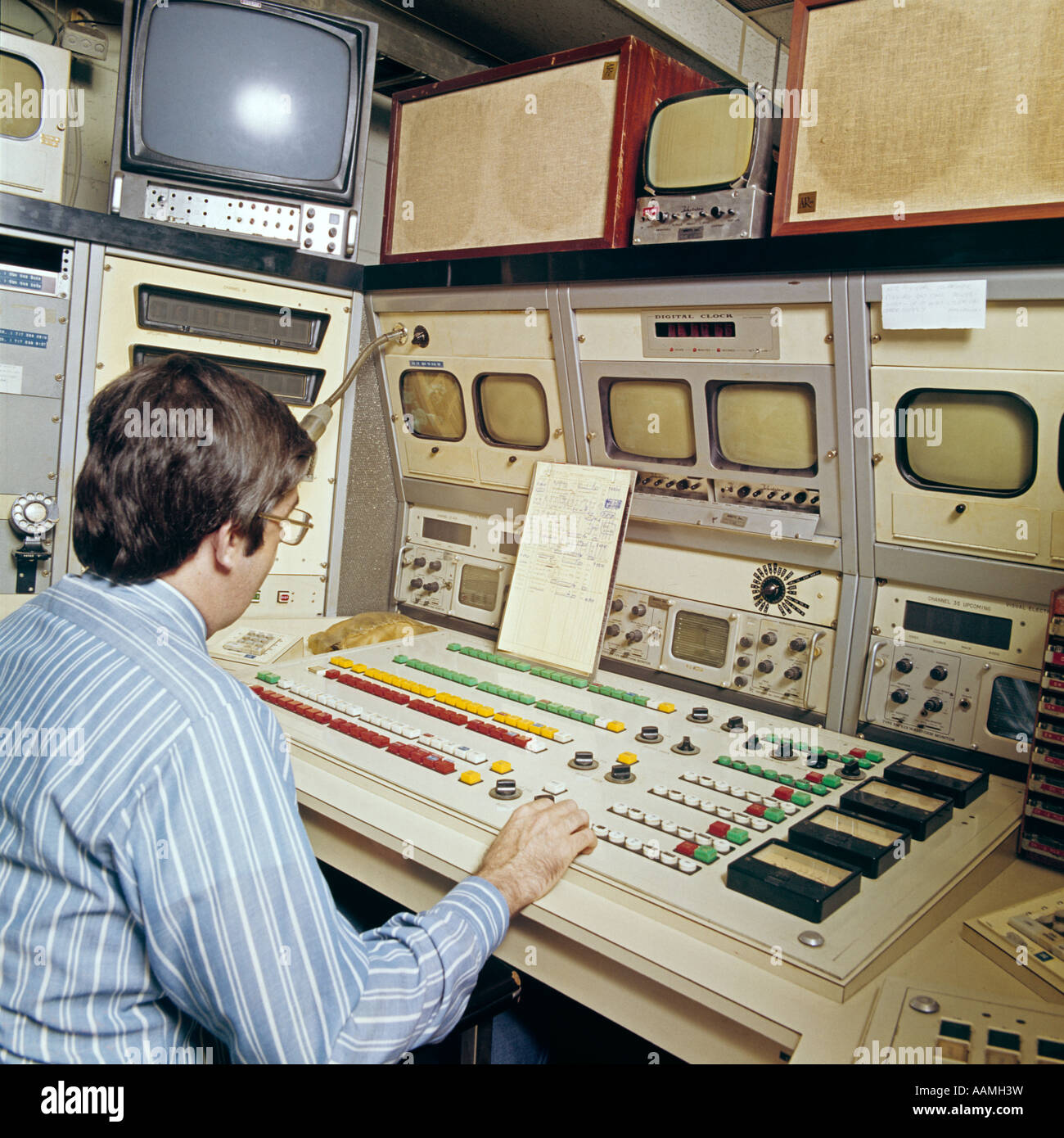 1970s MAN AT CONTROL ROOM CONSOLE OF TV STUDIO Stock Photo - Alamy