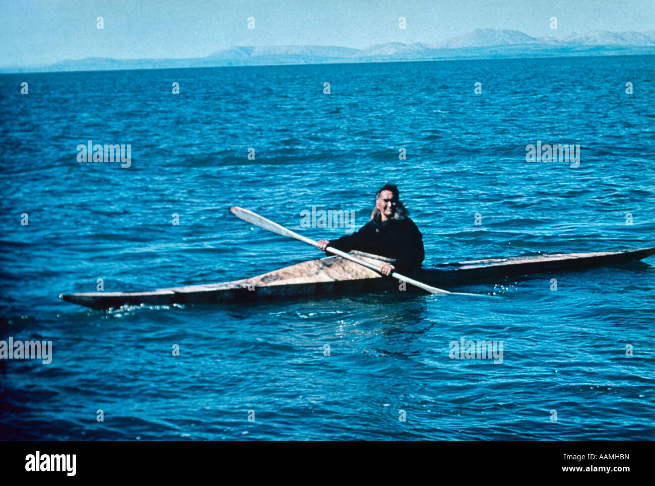 1960s INUIT MAN ESKIMO SKIN KAYAK PADDLE ARCTIC OCEAN KOTZEBUE ALASKA ...