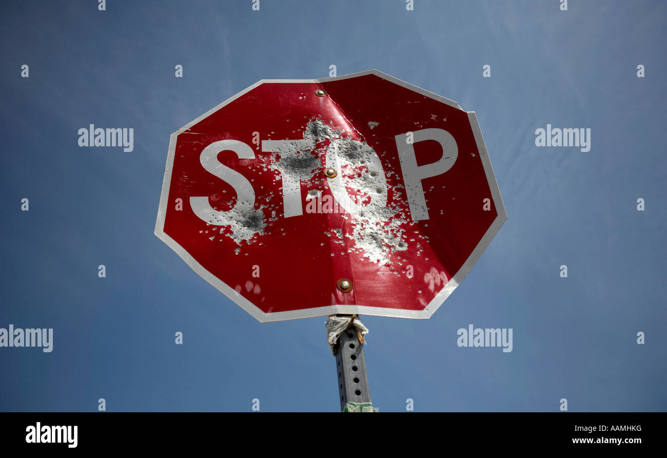 Stop sign dents from bullets hi-res stock photography and images - Alamy