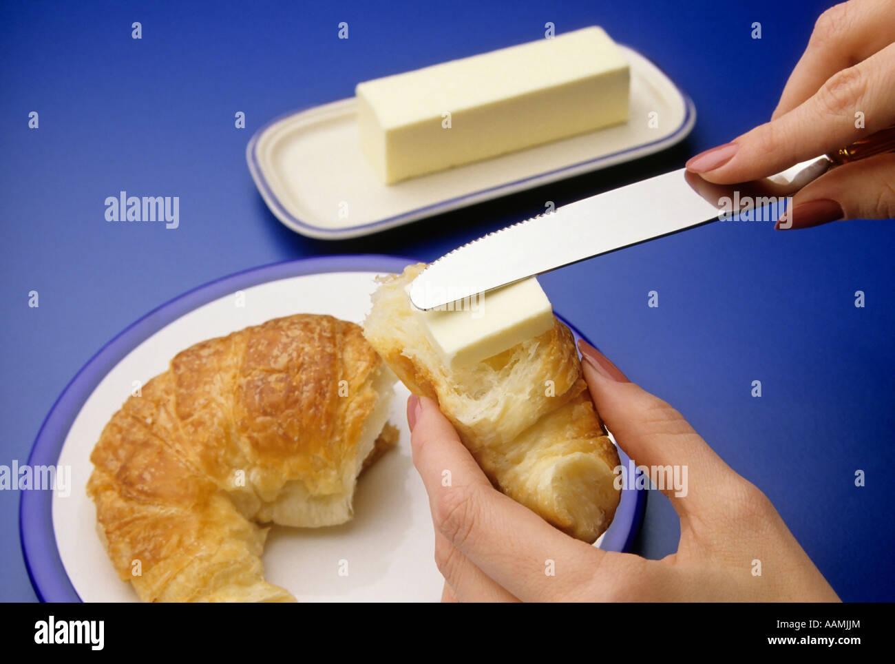 Croissant with butter Stock Photo - Alamy