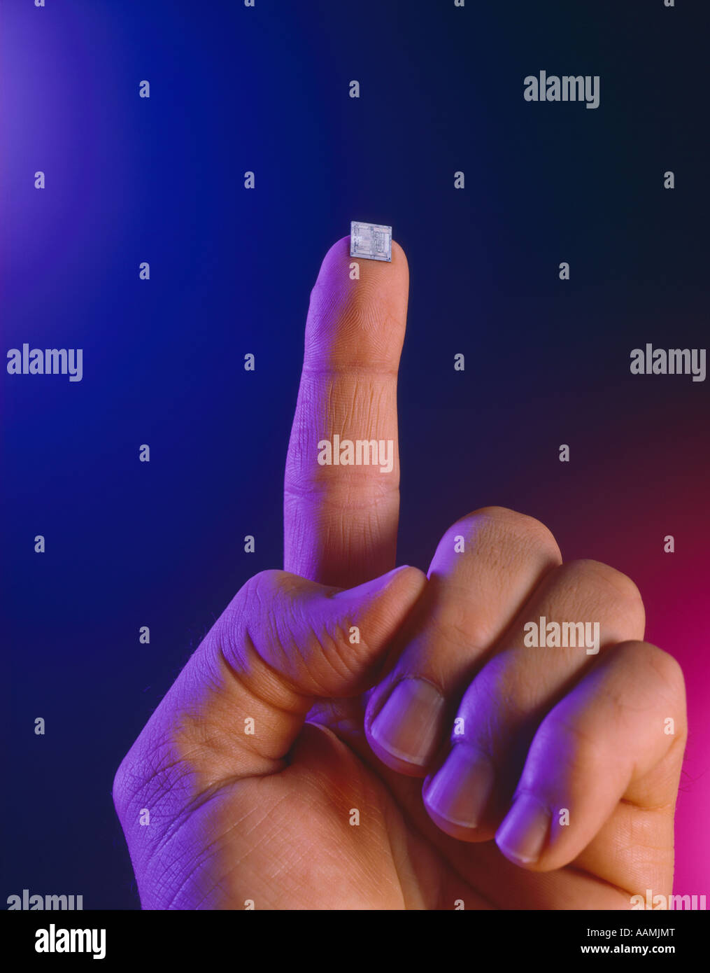 FINGER HOLDING MICRO CHIP Stock Photo - Alamy