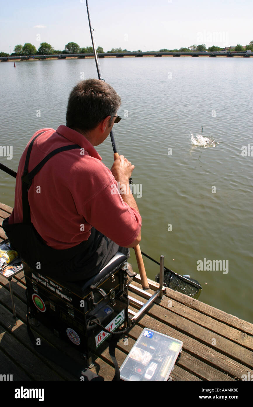 Man fishing for carp on lake near Daventry England Stock Photo - Alamy