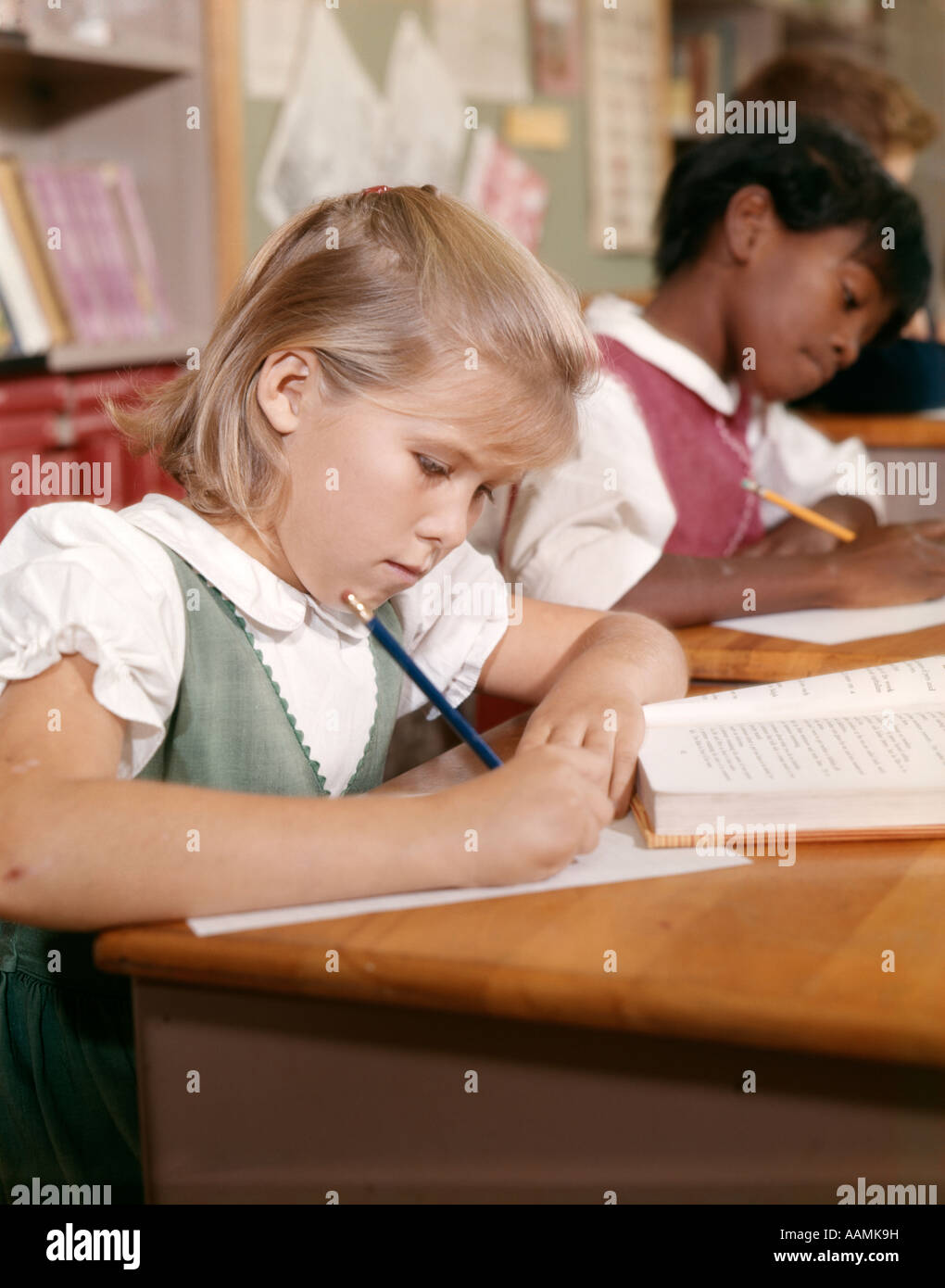 GIRL WRITING IN SCHOOL Stock Photo - Alamy