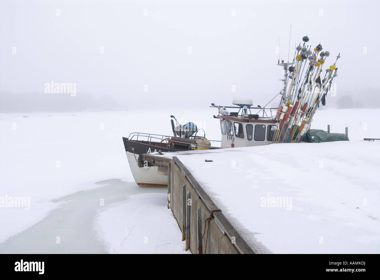 Frozen fishing boat Stock Photo - Alamy