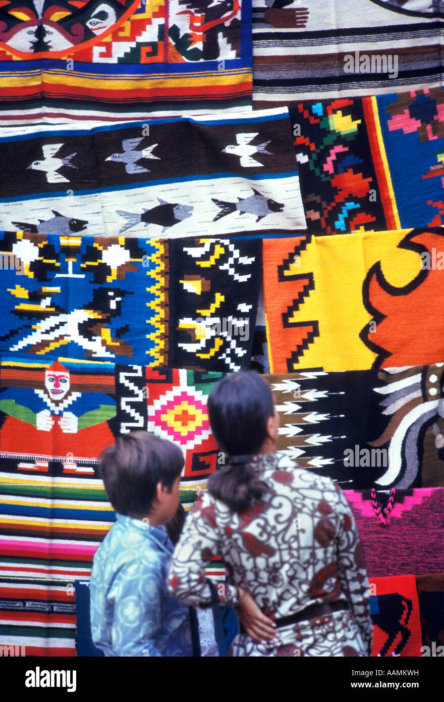 Two people looking at colorfull Mexican rugs Mexico City Mexico Stock ...