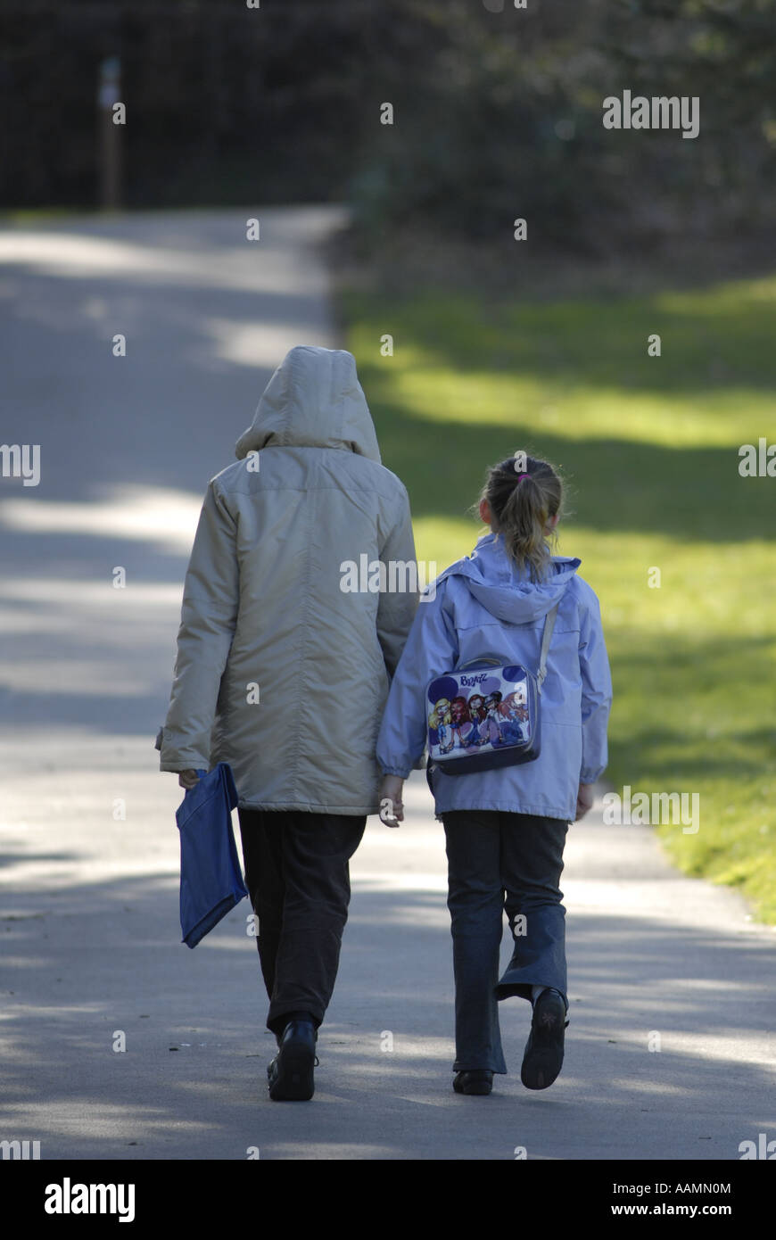 A family walk to school in the morning Stock Photo - Alamy