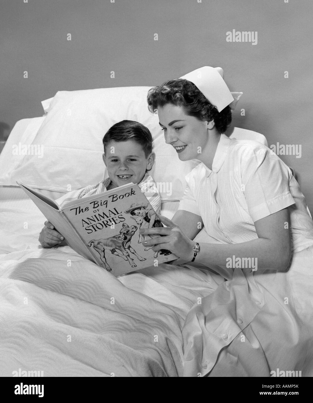 1950s NURSE BOY PATIENT HOSPITAL BED STORY BOOK HOSPITAL READING Stock ...