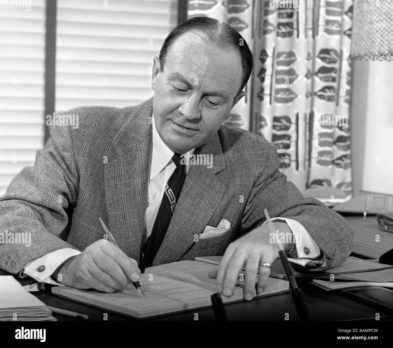 1950s man sitting at desk Black and White Stock Photos & Images - Alamy