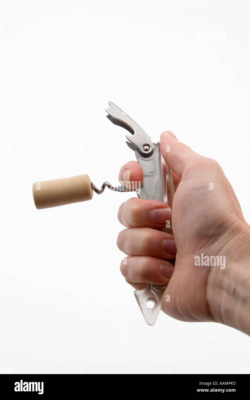 Hand holding corkscrew hi-res stock photography and images - Alamy