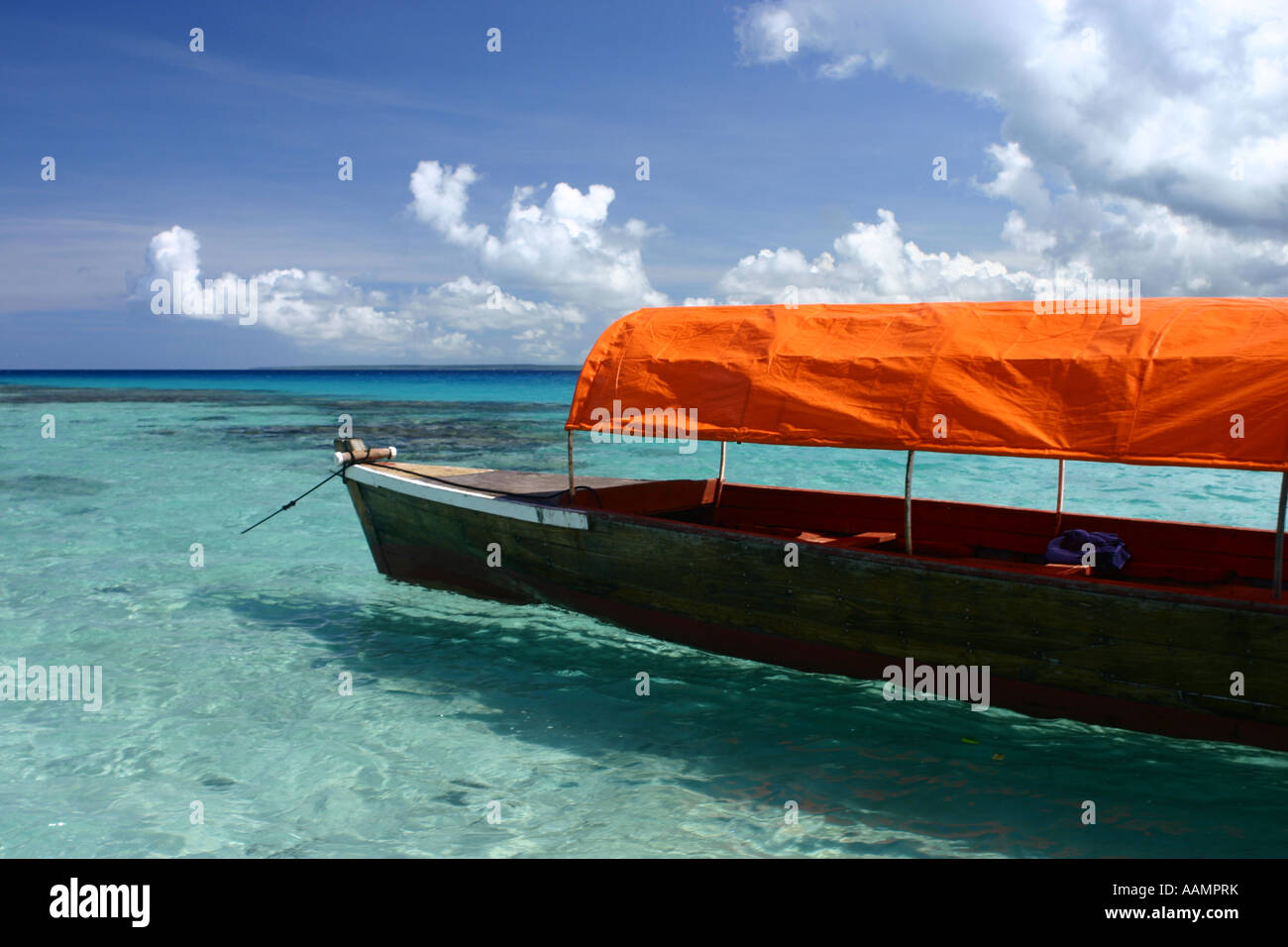 Small tourist boat moored off the beach near Zanzibar Stock Photo - Alamy