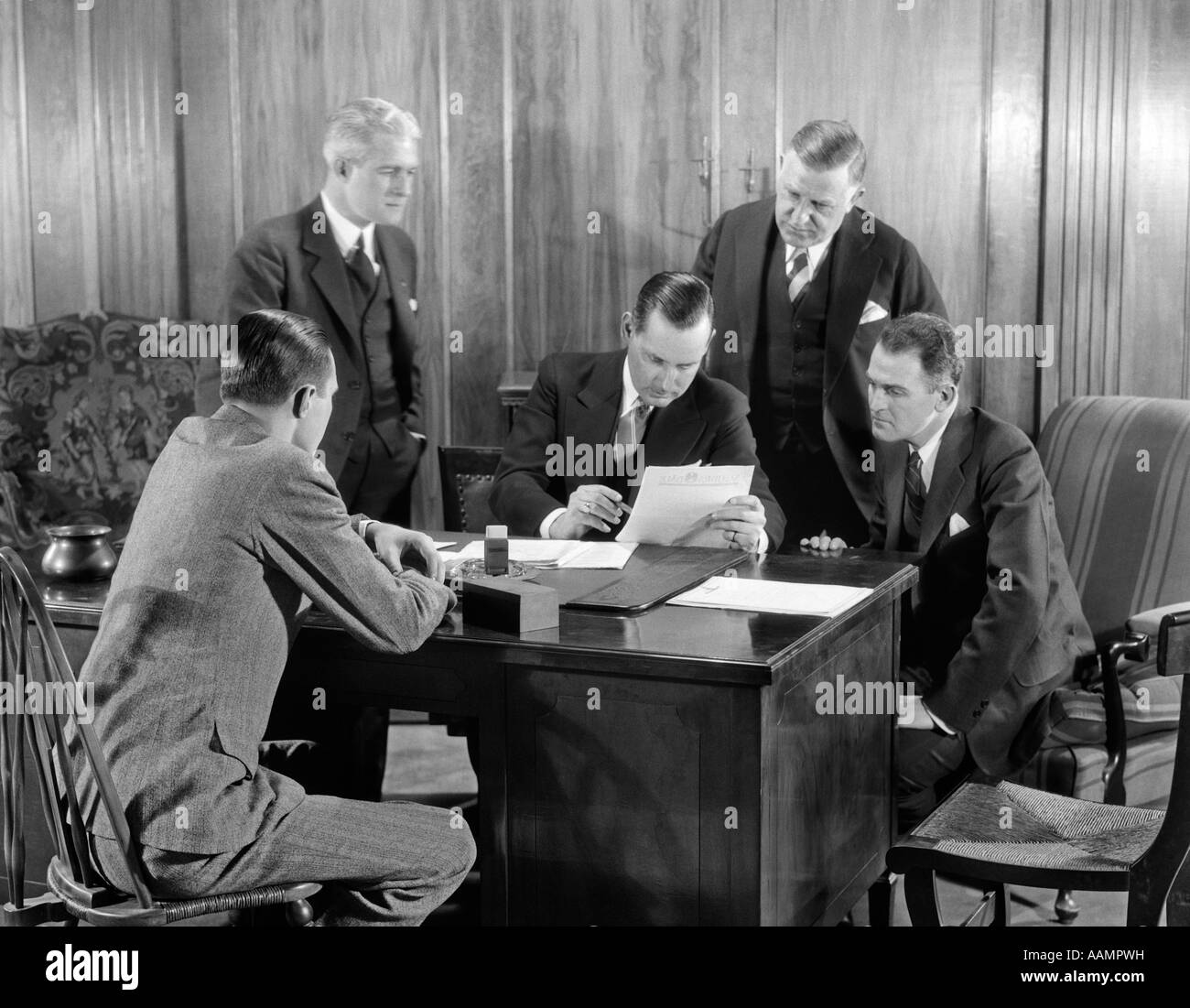 1930s RETRO MEN MEETING DESK BUSINESS SUITS PAPERWORK Stock Photo - Alamy