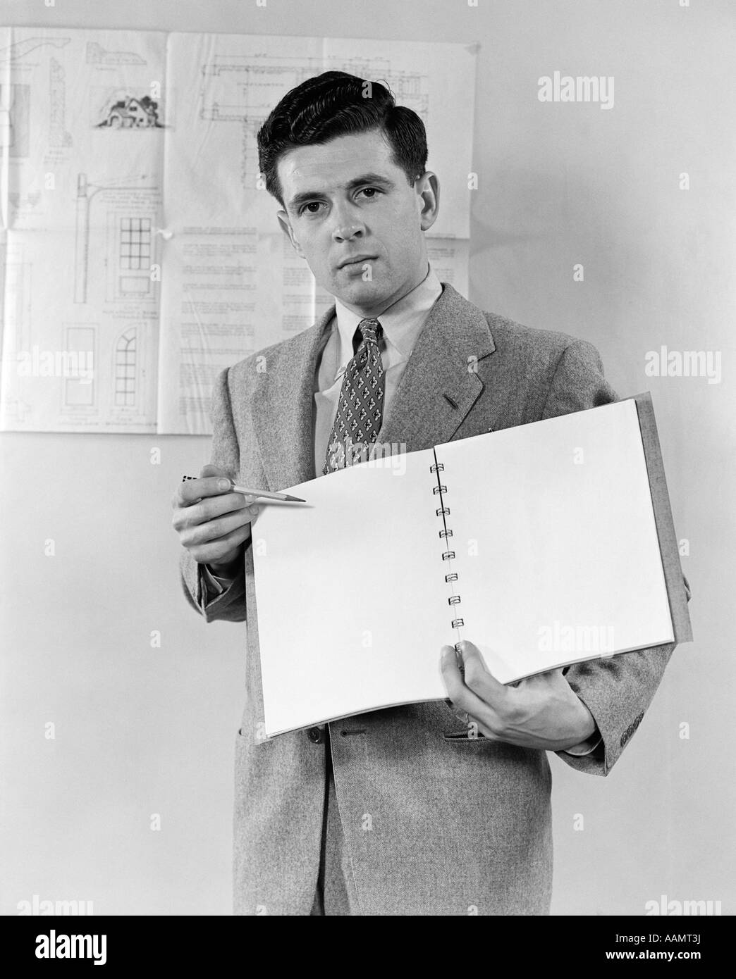 1940s BUSINESS MAN HOLDING NOTEBOOK AND PENCIL PRESENTATION Stock Photo ...