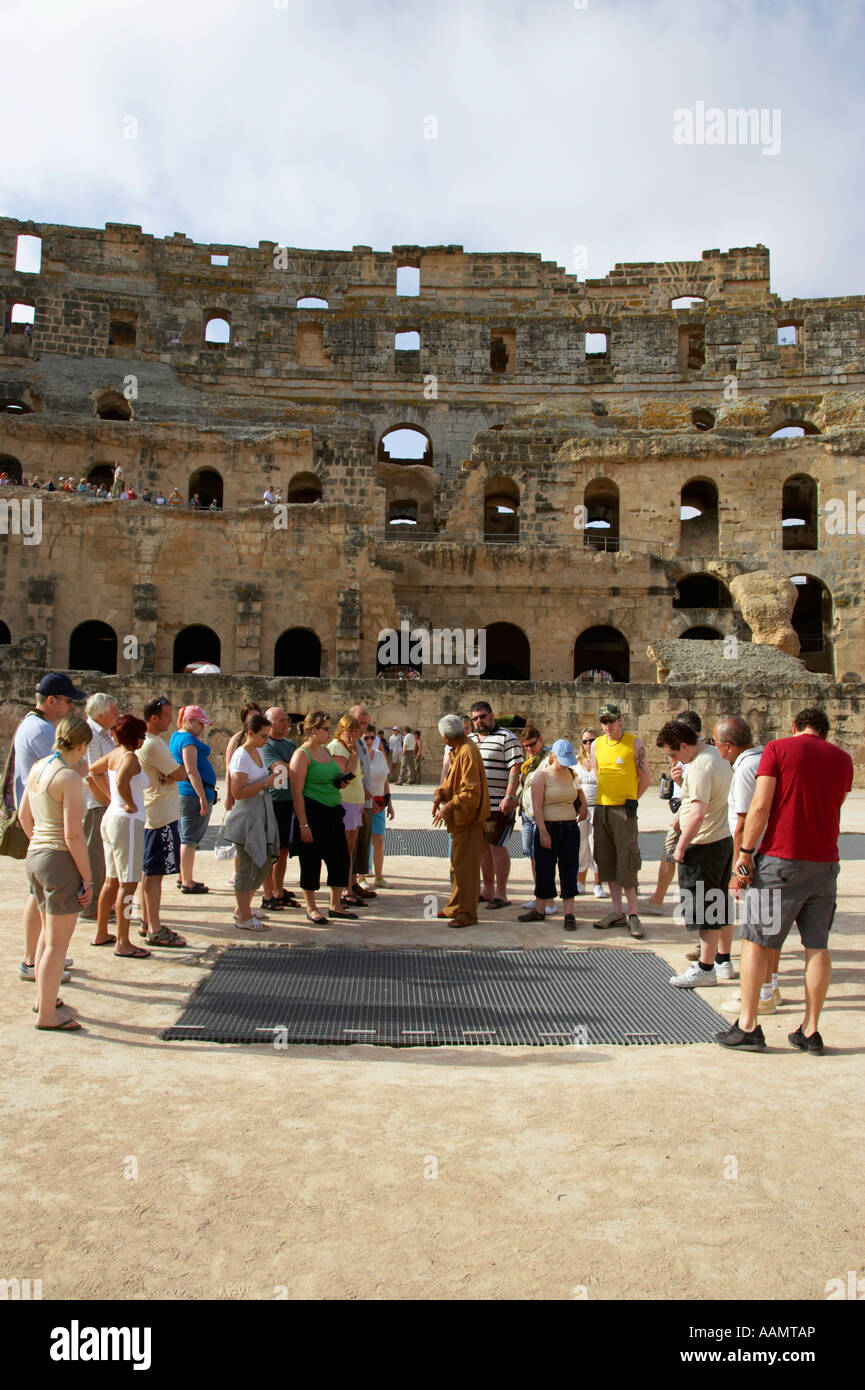 tour guide explains to group of british tourists about gladiator pits ...