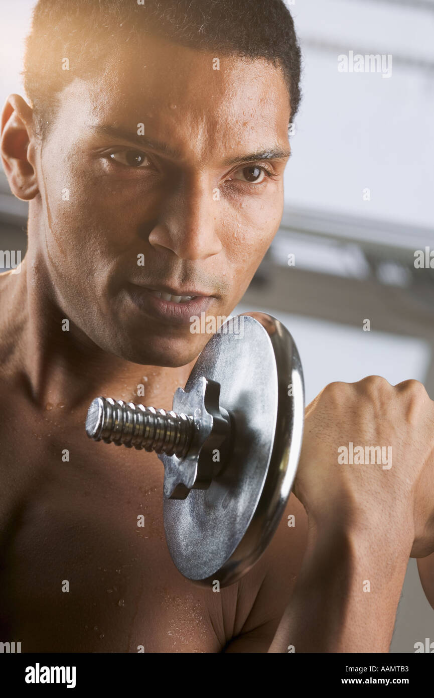 Man lifting weights Stock Photo - Alamy