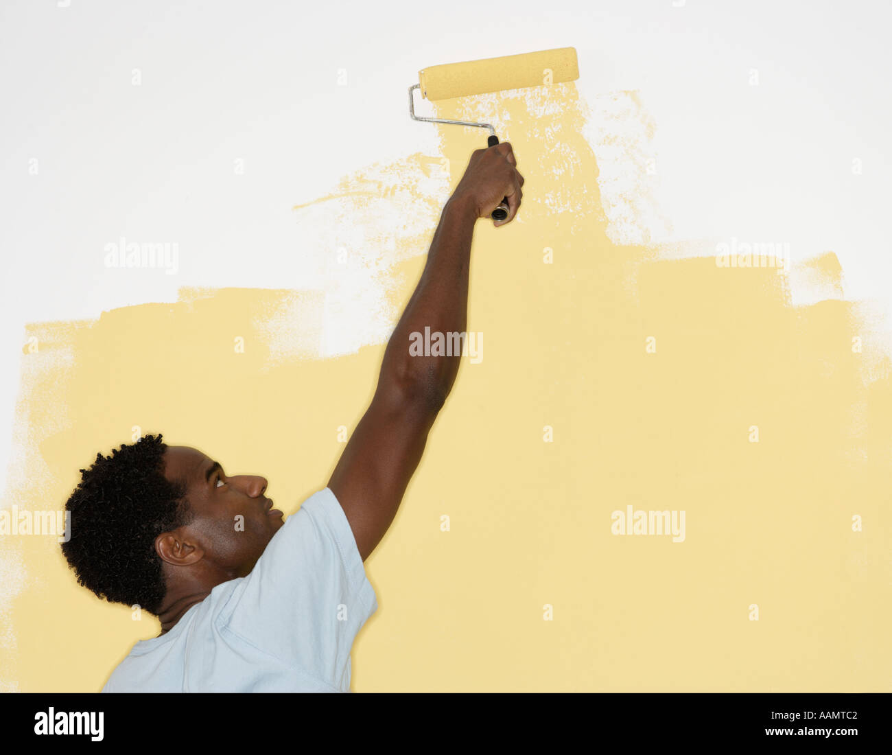 Man painting wall Stock Photo - Alamy