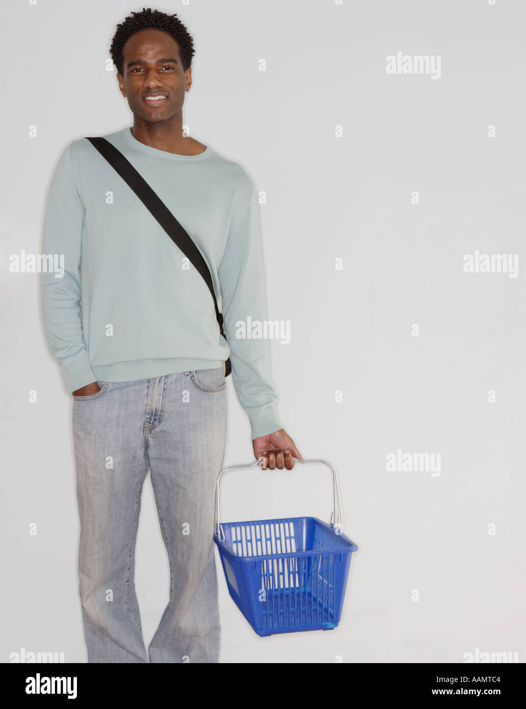 Person carrying shopping basket hi-res stock photography and images - Alamy