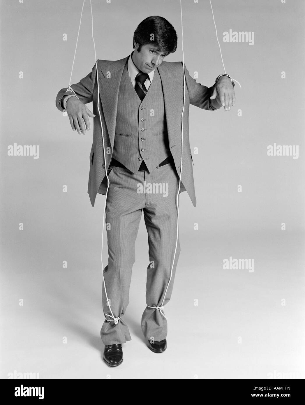 1970s BUSINESSMAN PUPPET STRINGS ATTACHED TO HANDS AND FEET WEARY ...