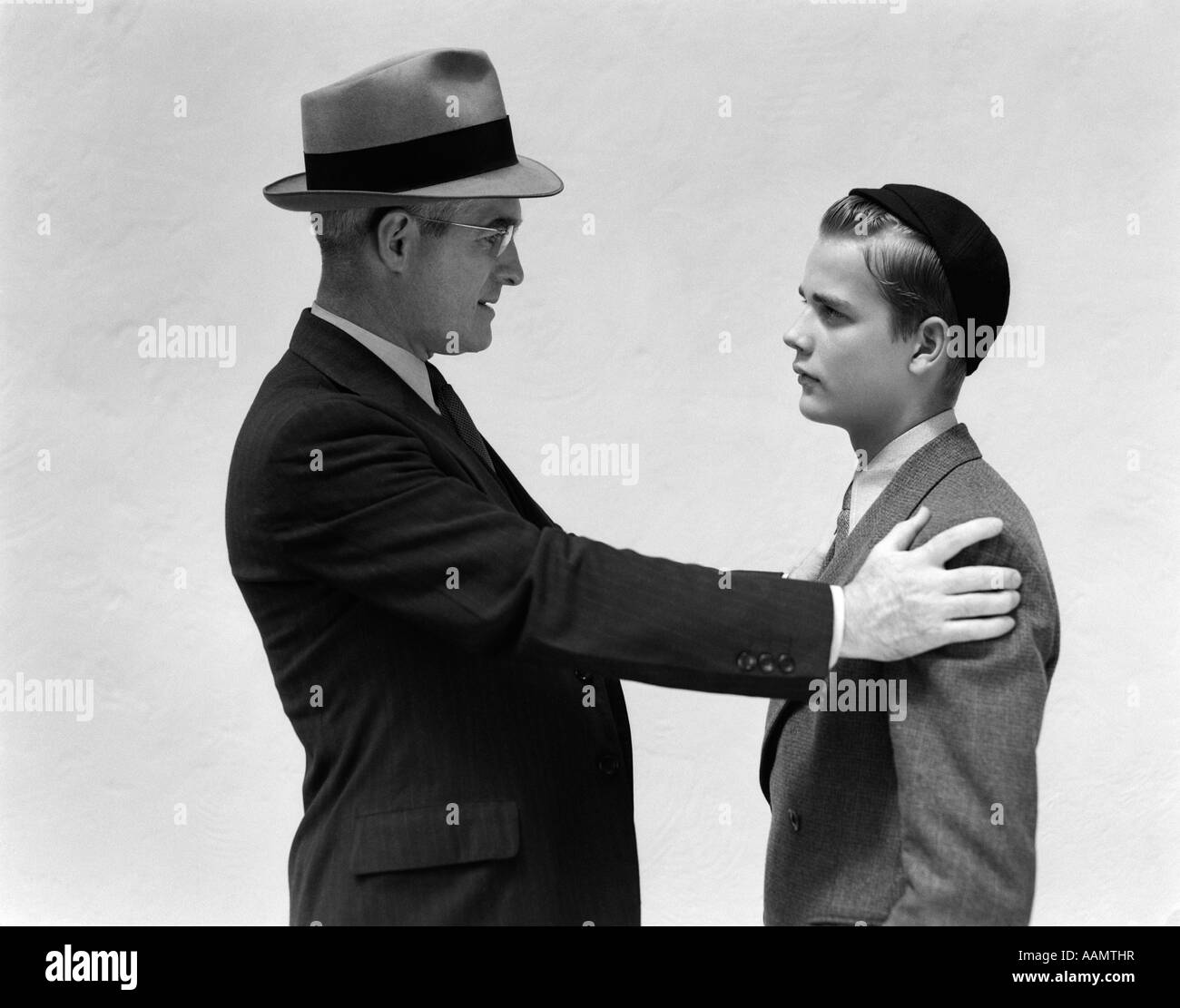 1940s MAN AND BOY FATHER SON FACING EACH OTHER BOTH IN HATS AND SUITS ...