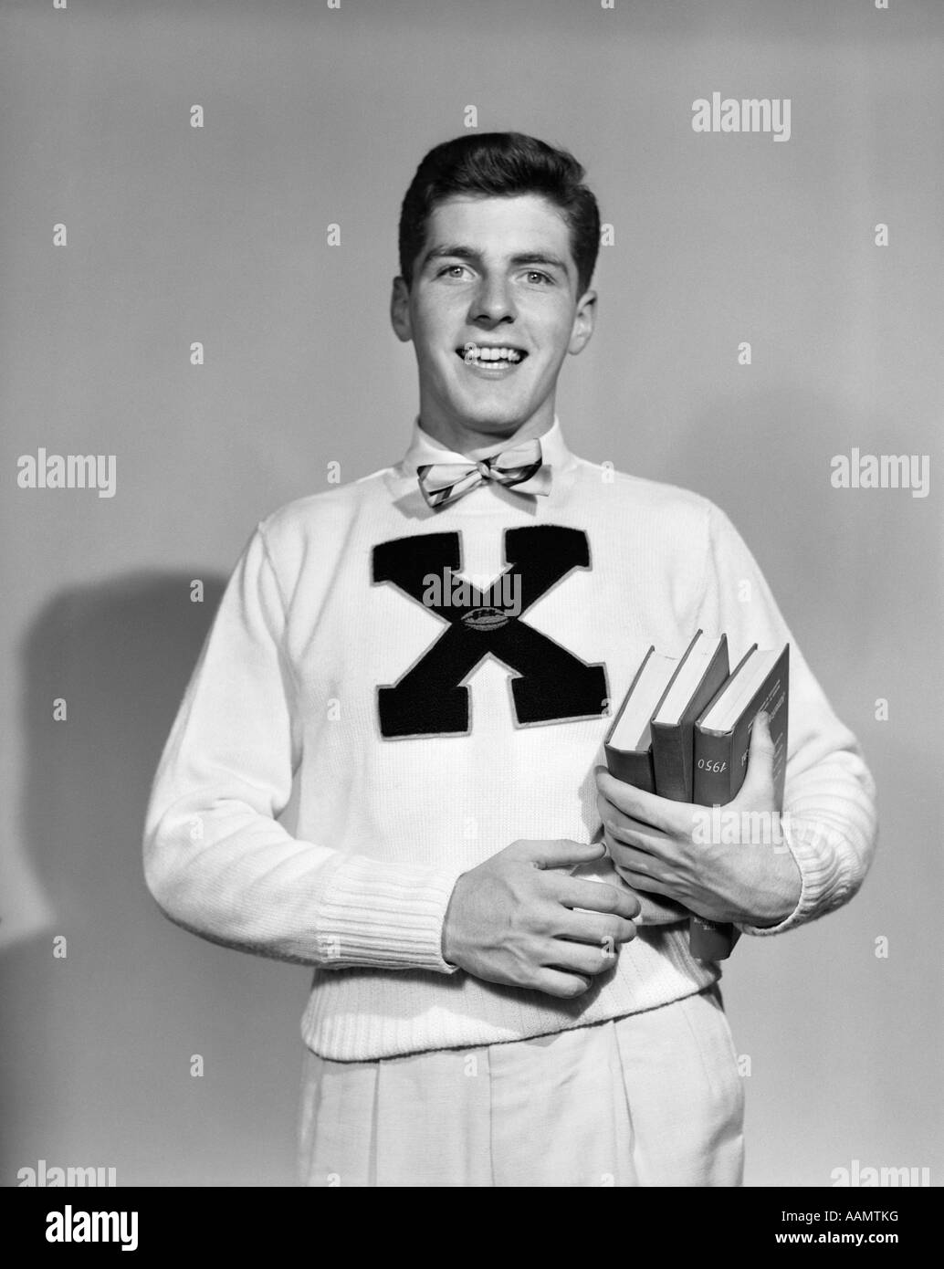 1940s 1950s SMILING PORTRAIT BOY STUDENT CARRYING BOOKS WEARING ...