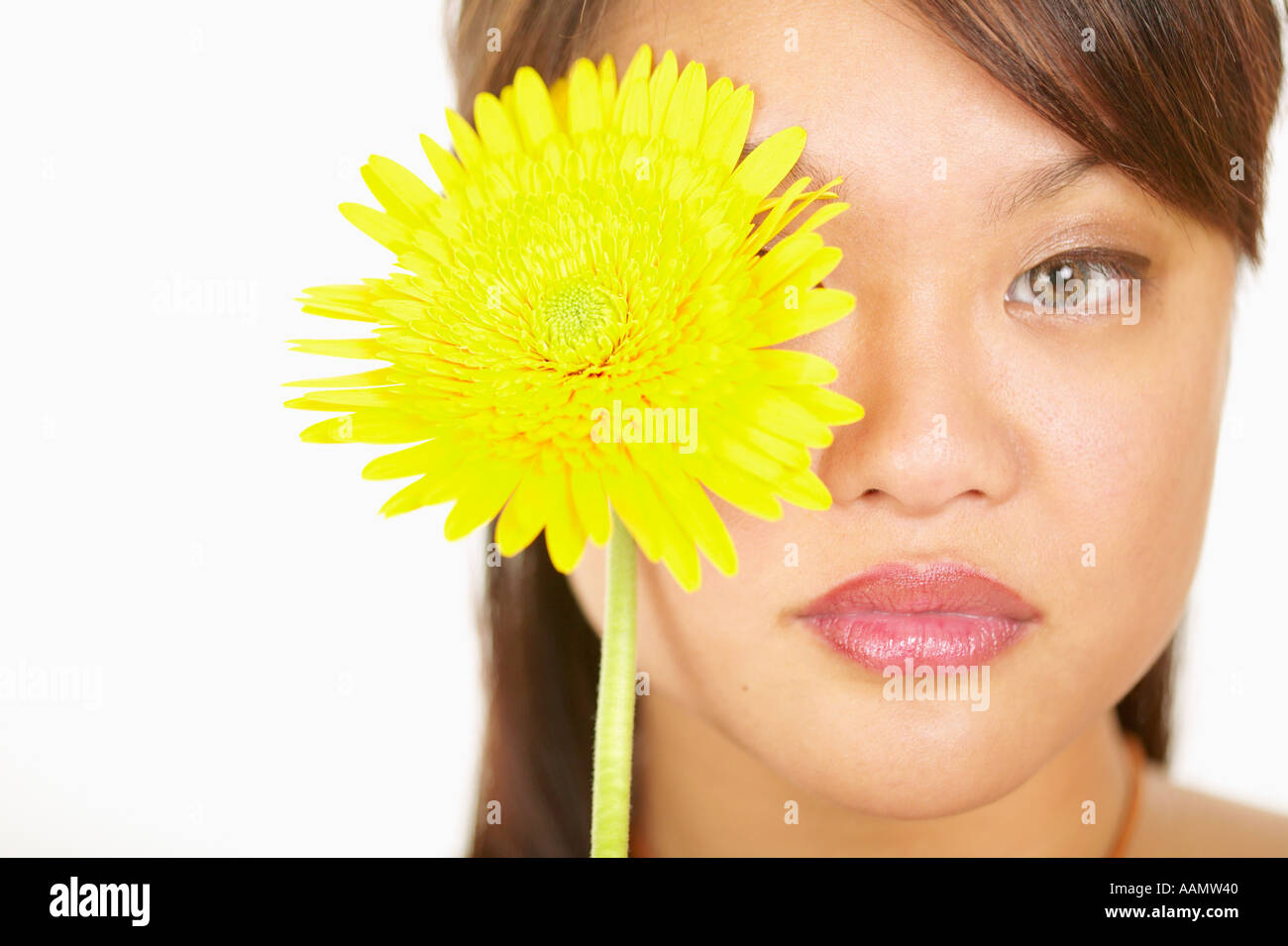 Woman flower over one eye hi-res stock photography and images - Alamy