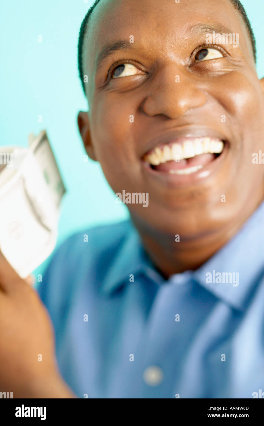 Man holding stack of money Stock Photo - Alamy