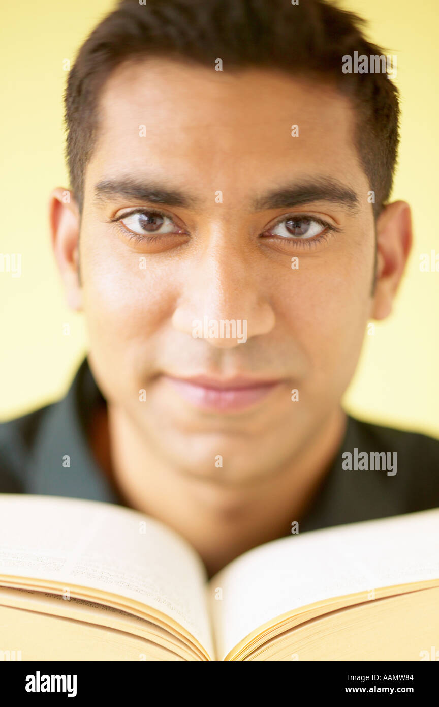 Portrait of man reading book Stock Photo - Alamy