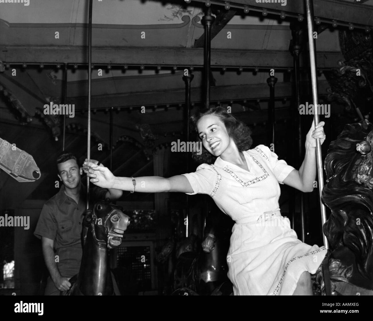 Woman riding carousel horse High Resolution Stock Photography and ...