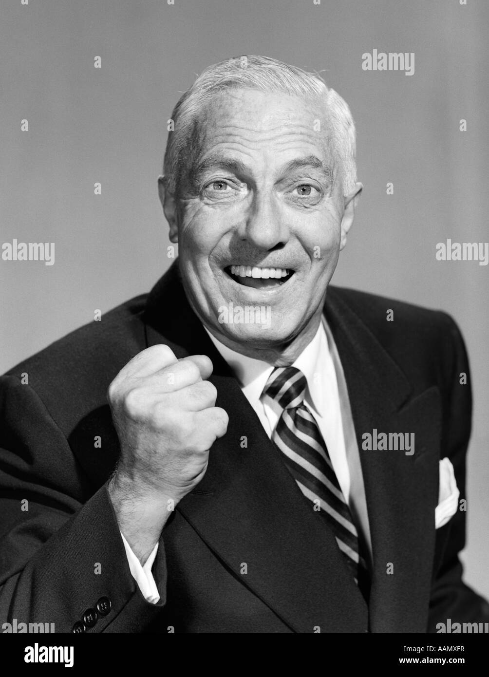 1950s SENIOR BUSINESS MAN MAKING FIST SMILING DETERMINED FACIAL ...