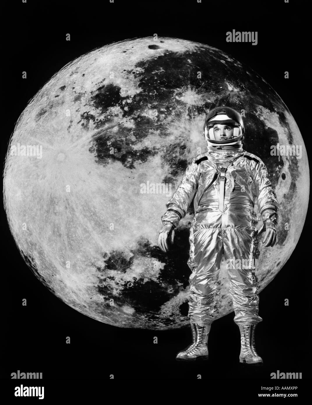 1960s MAN IN SILVER ASTRONAUT SUIT WITH MOON IN BACKGROUND Stock Photo ...