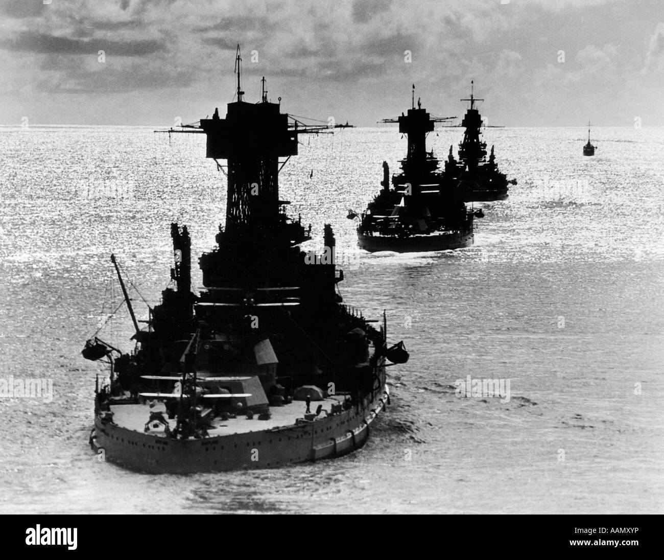 1930s 1940s LINE OF THREE US NAVY BATTLESHIPS IN OCEAN STERN VIEW Stock ...