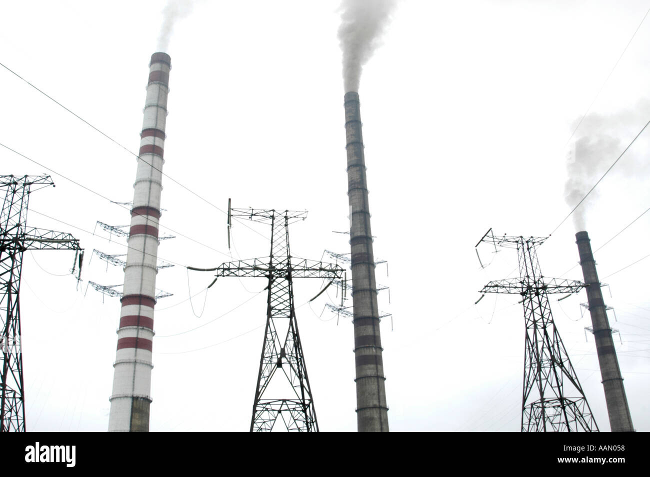 smoke stacks, high tension poles Stock Photo - Alamy