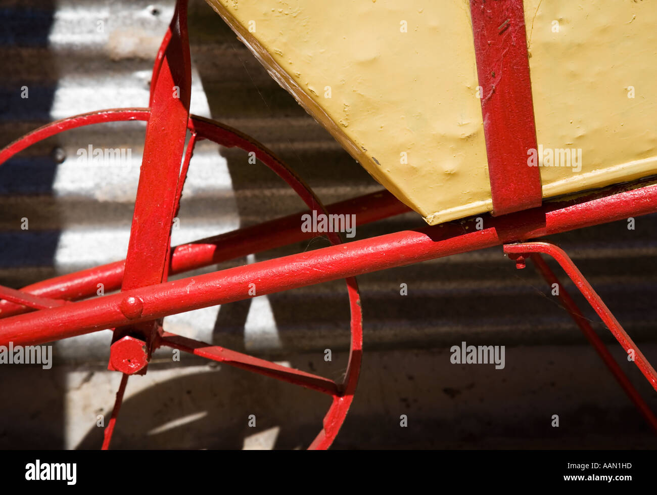 Red and yellow antique wheelbarrow Stock Photo - Alamy