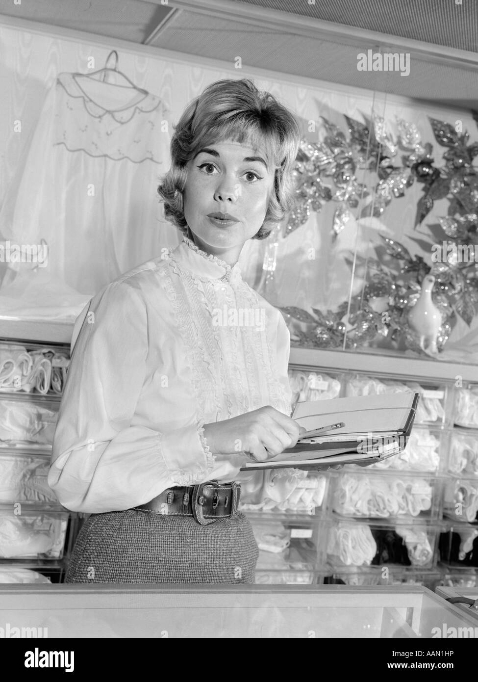 1960s WOMAN DEPARTMENT STORE SALES CLERK BEHIND COUNTER HOLD PENCIL ...
