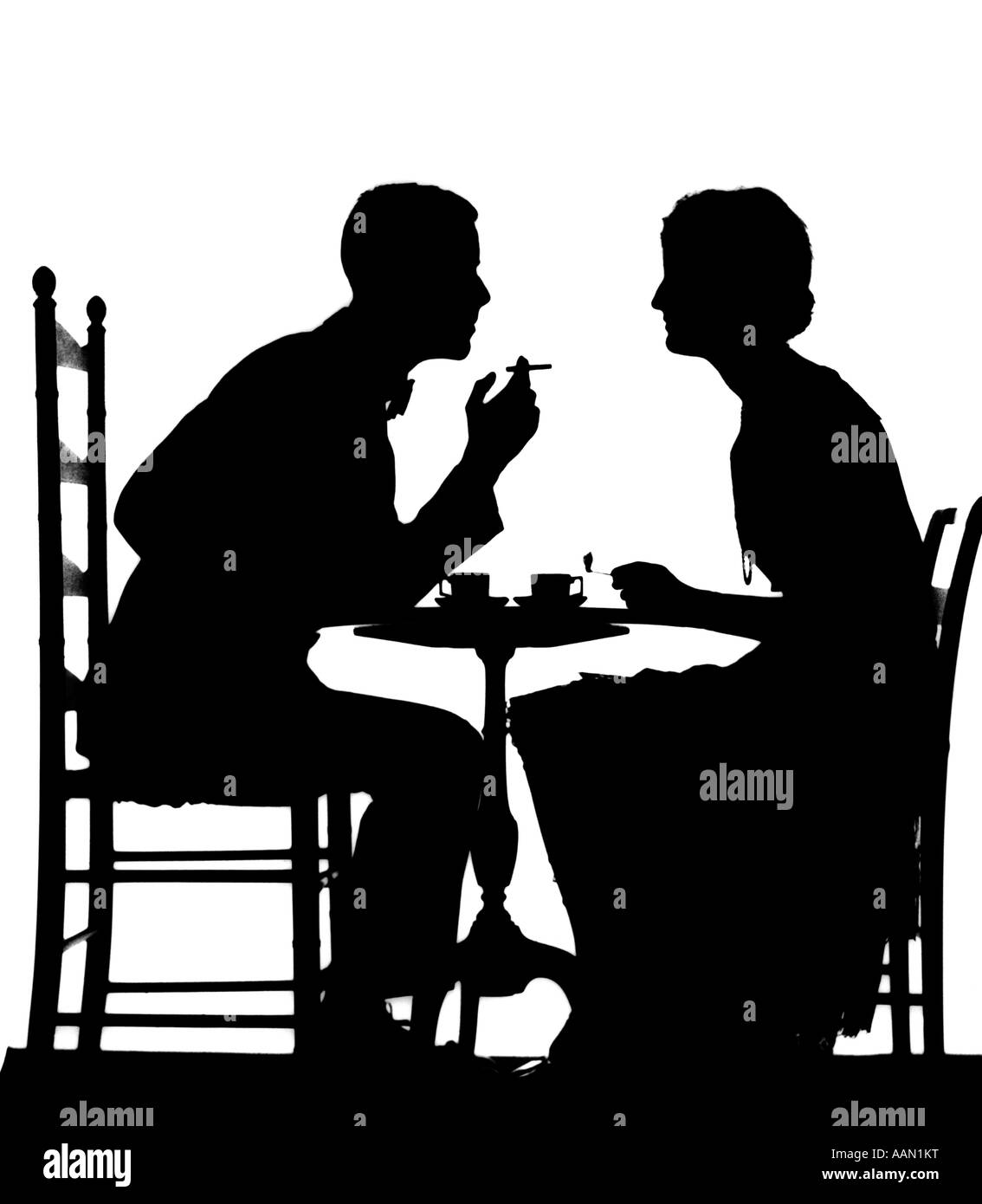 Man woman sit table Black and White Stock Photos & Images - Alamy
