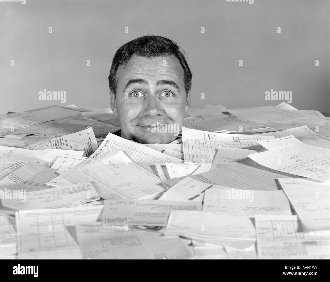 Man buried in paper hi-res stock photography and images - Alamy