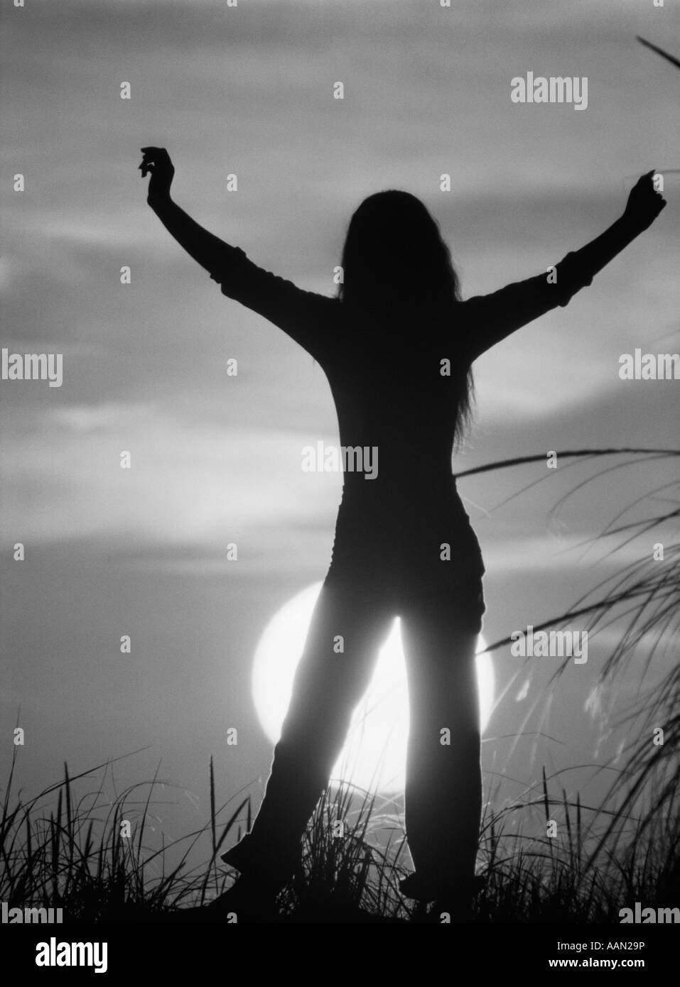 Female standing arms above head Black and White Stock Photos & Images ...