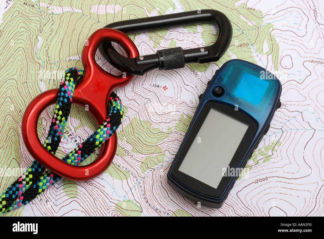 Image contains a figure eight belay device, locking carbineer, rope and ...