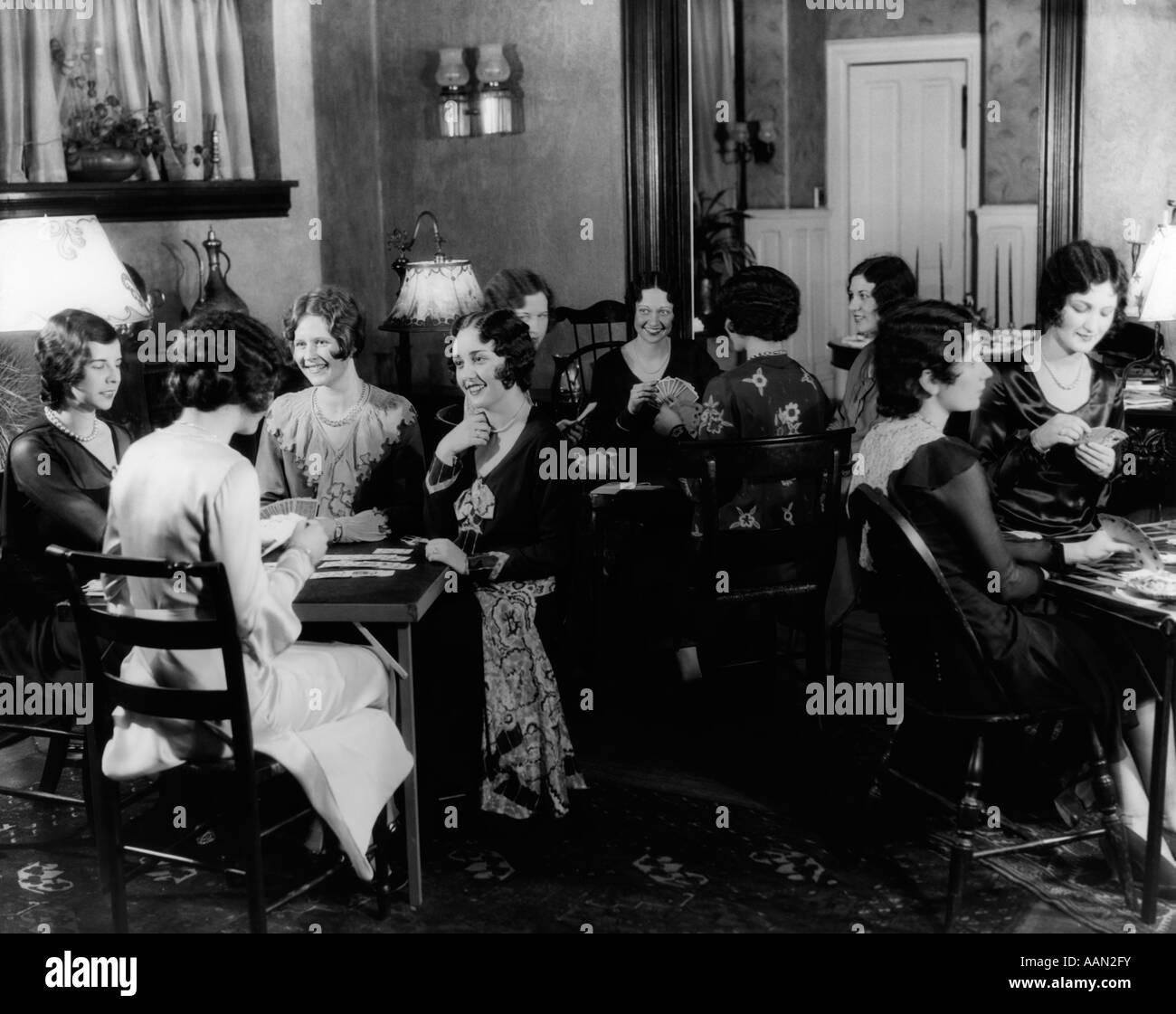 1930s GROUPS OF WOMEN SEATED AT THREE TABLES AT CARD PARTY Stock Photo ...